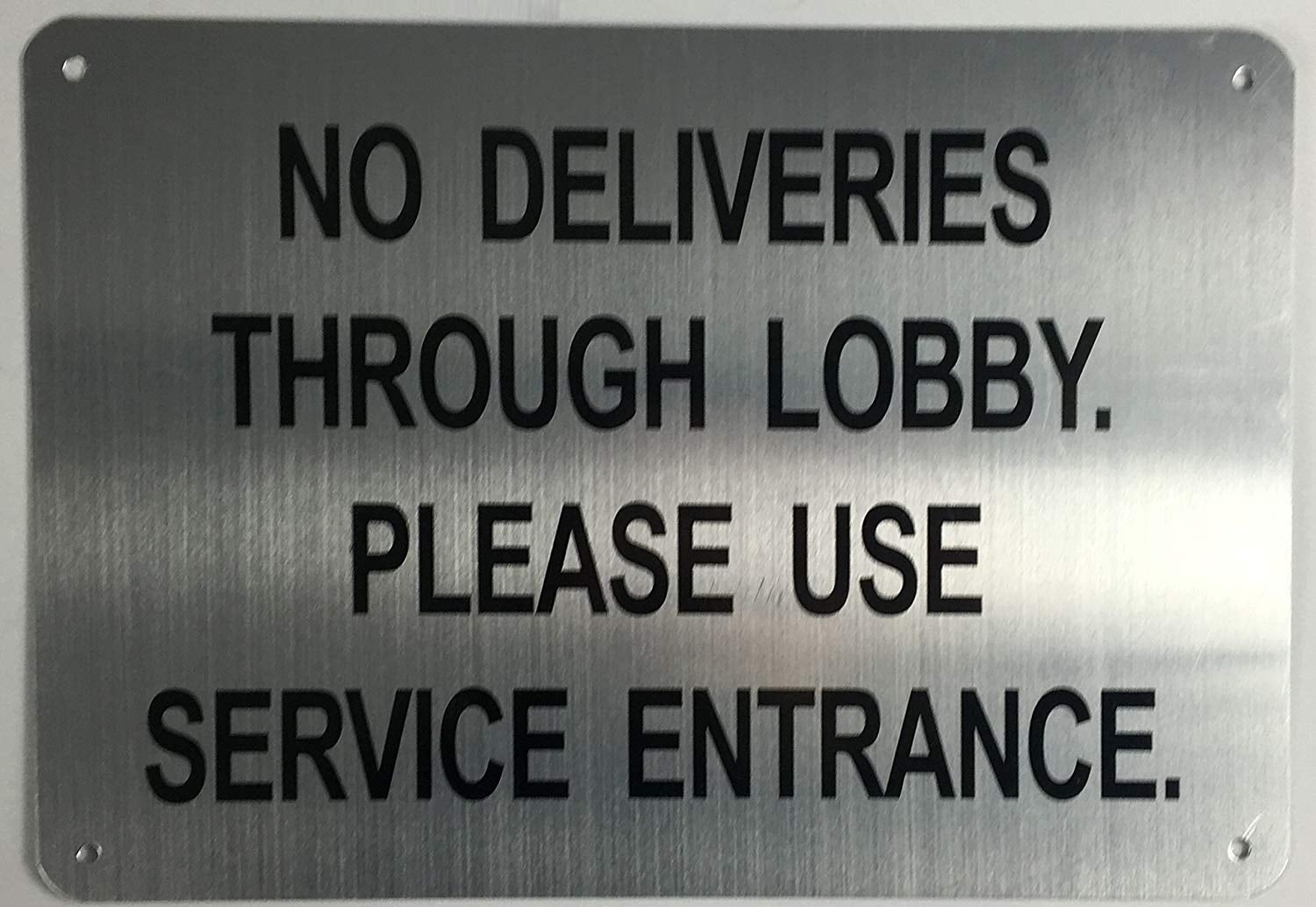 NO DELIVERIES THROUGH LOBBY PLEASE USE SERVICE ENTRANCE SIGN ( BRUSH ...