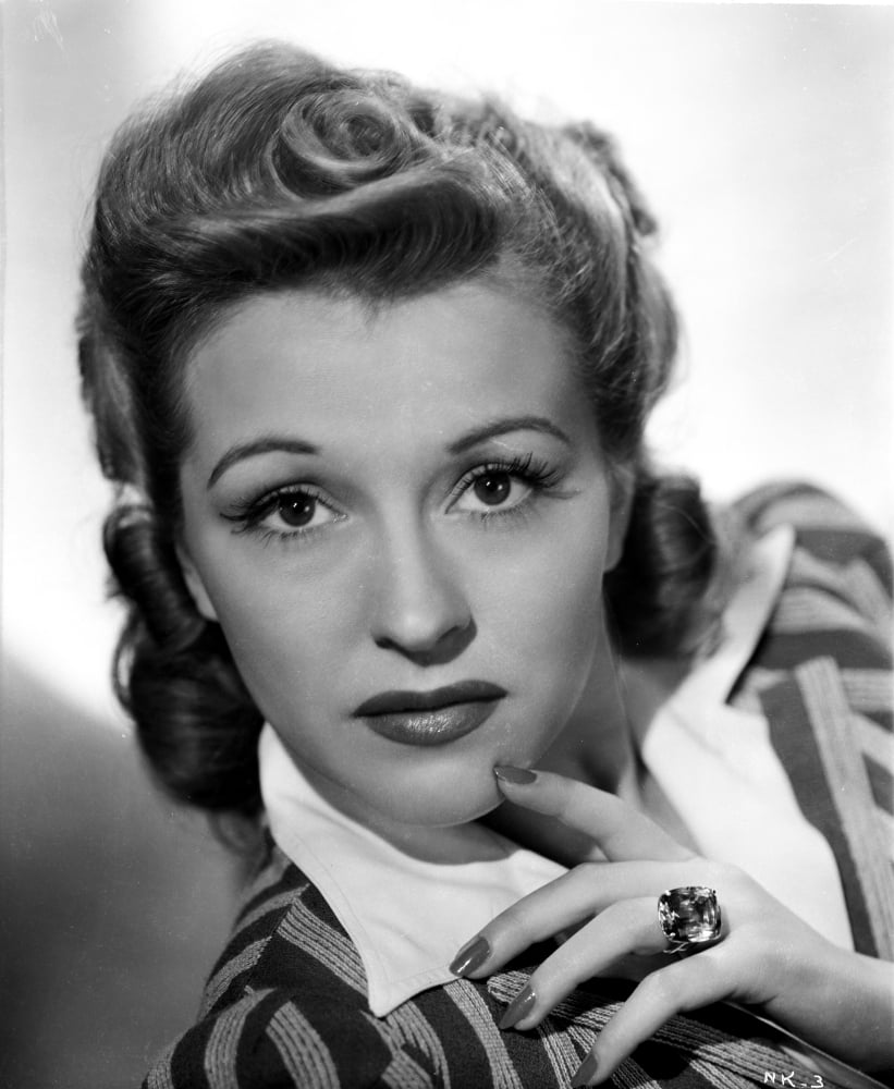 Nancy Kelly on a Stripe Top and Finger on Chin Photo Print (24 x 30 ...