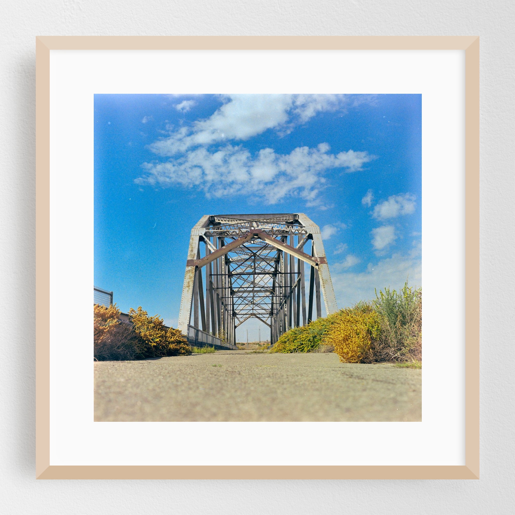 Nostalgic journey on Route 66 beneath the vintage iron bridge reaching ...