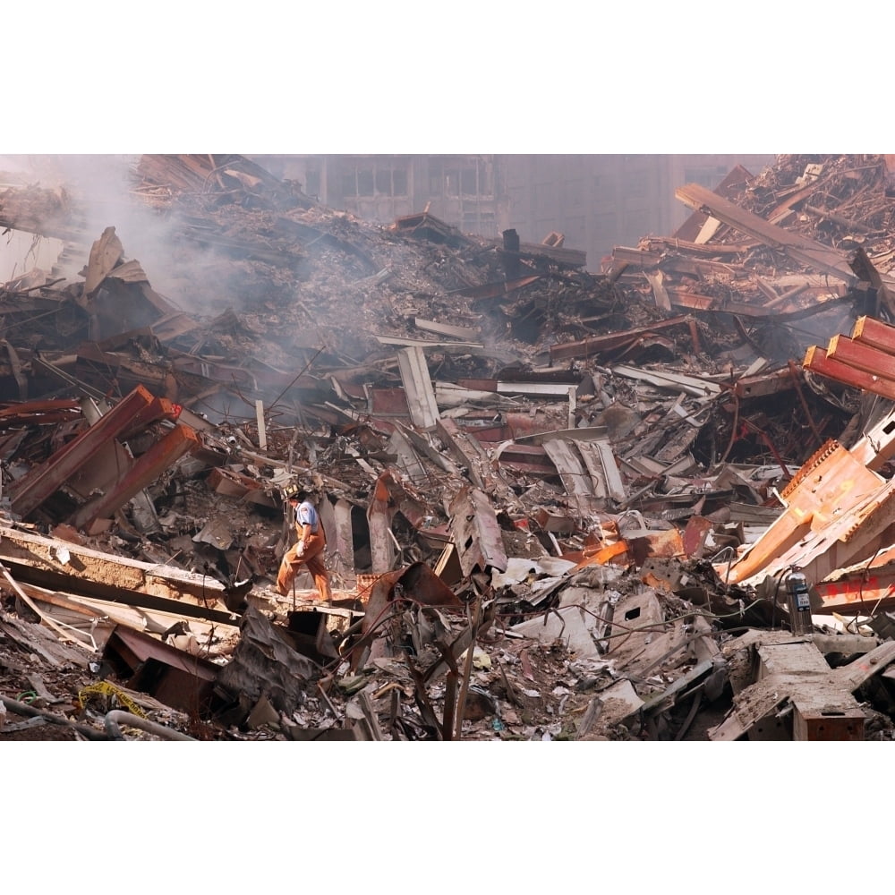 Nyc Fire Fighter Walks Over Smouldering Fires And Wreckage At Ground ...