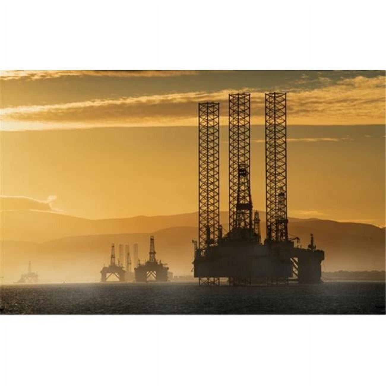 Oil Drilling Rigs Out in The Ocean with A View of The Coastline ...