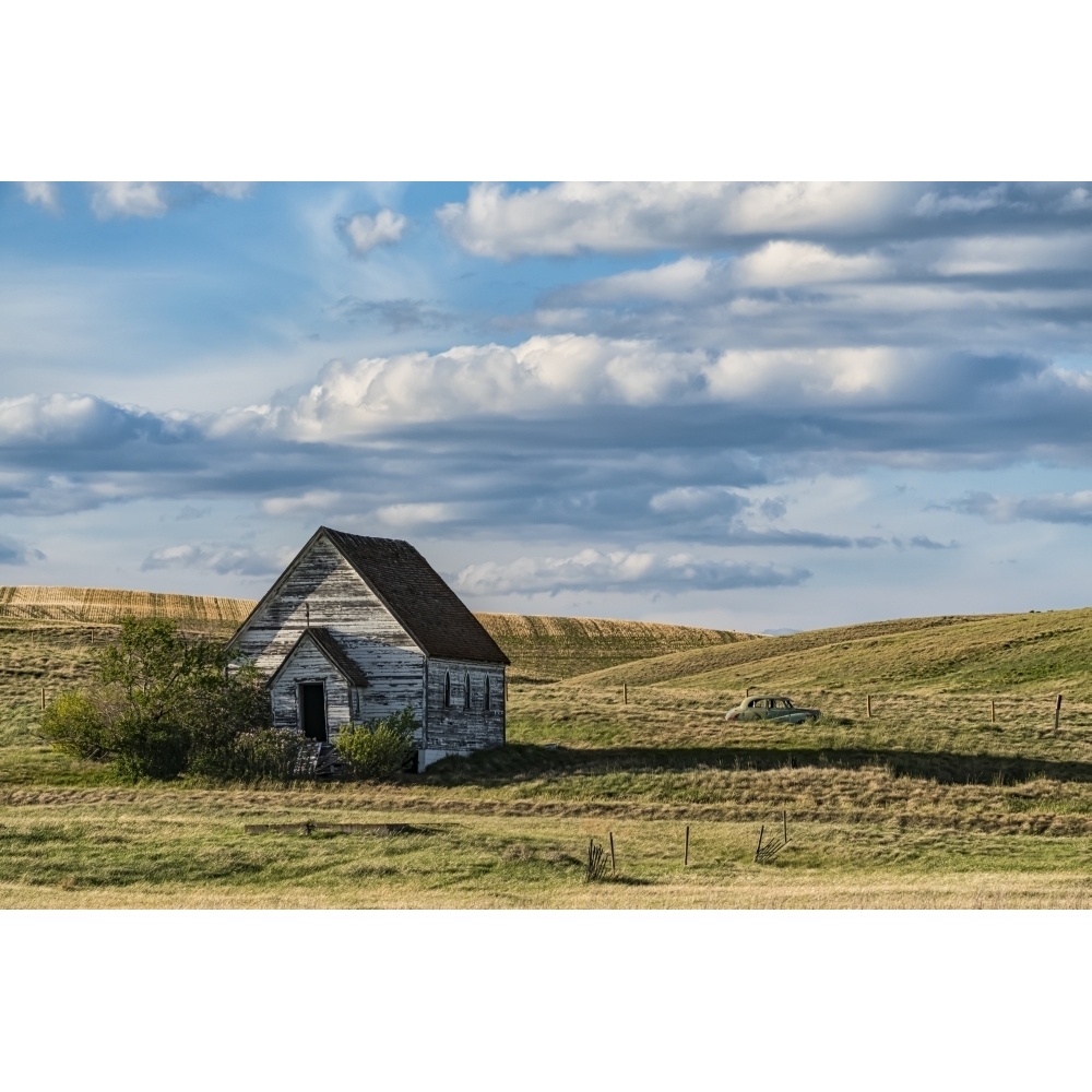 Old abandoned country church weathered from the years on the prairies ...