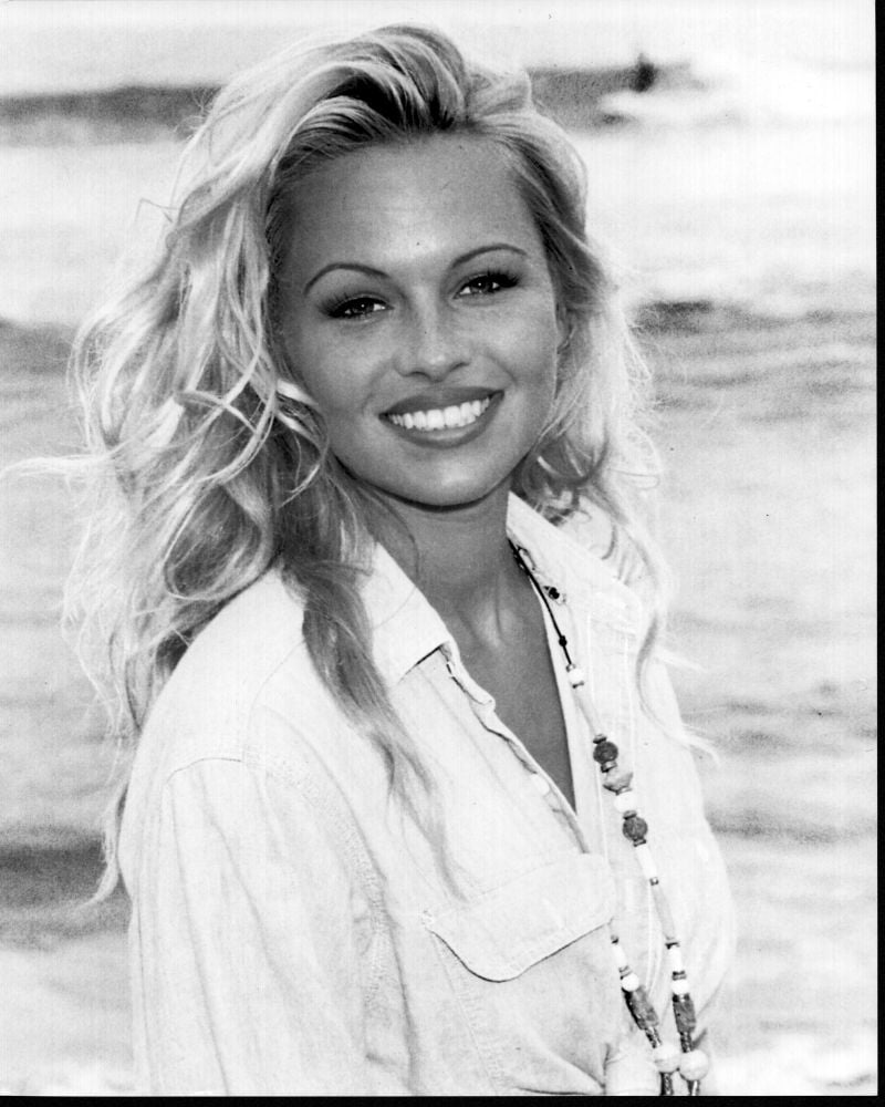 Pamela Anderson Smiling In Button Down Shirt Black And White Photo ...