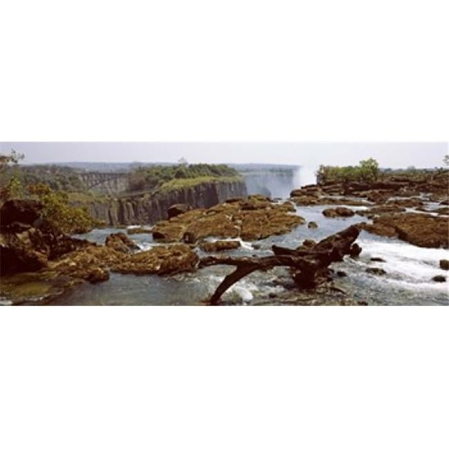 Panoramic Images Log on the rocks at the top of the Victoria Falls with ...