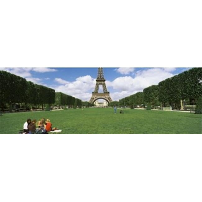 Panoramic Images PPI113493L Tourists sitting in a park with a tower in ...