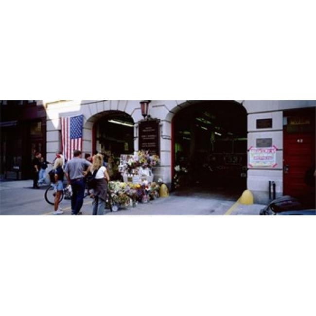 Panoramic Images Rear view of three people standing in front of a ...