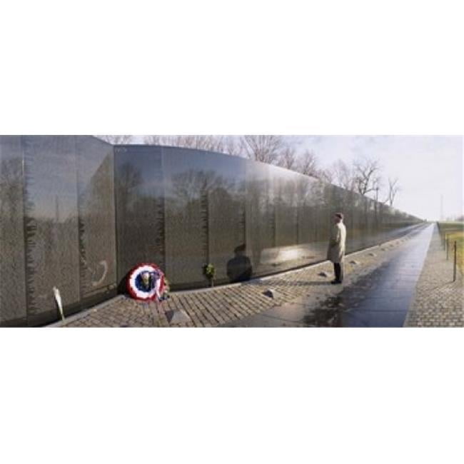 Panoramic Images Side profile of a person standing in front of a war ...