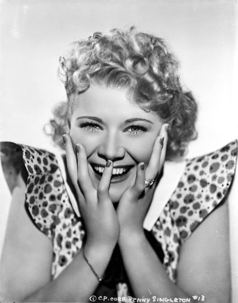 Penny Singleton smiling with Hands on Face in polka dot Dress Portrait ...