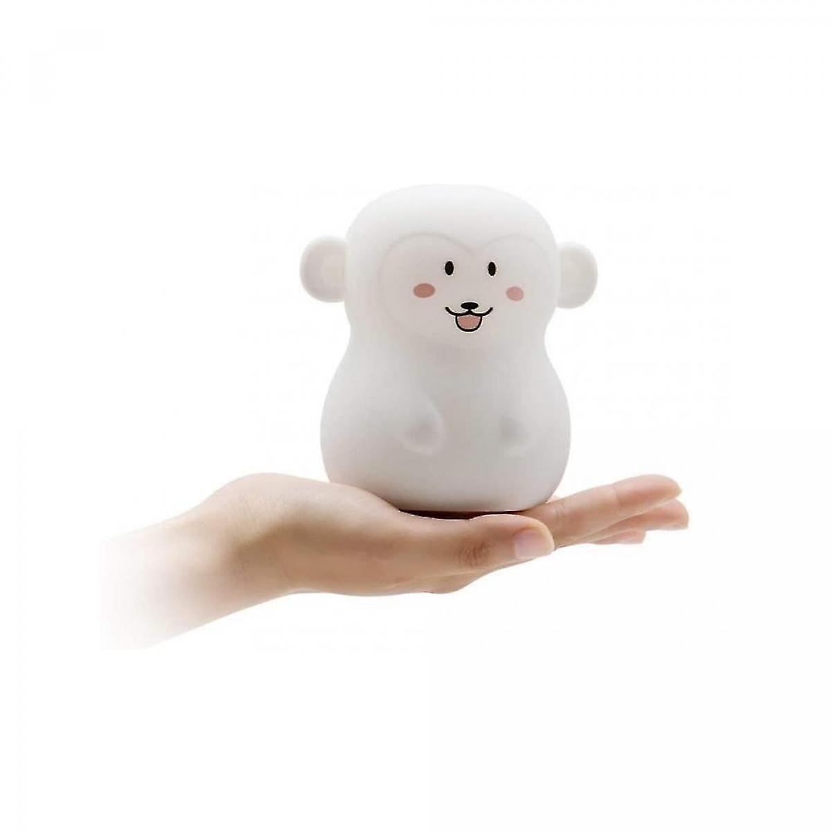 Photograph of bedroom headboard with light remote control (monkey ...