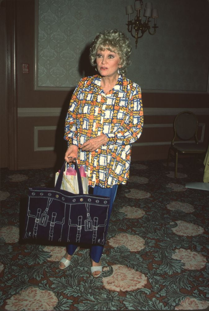 Phyllis Diller In Multi Colored Shirt Holding Weekender Bag Photo Print (16 x 20) - Item ...