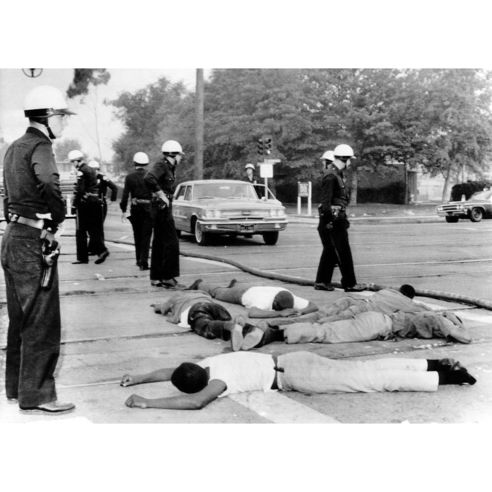 Police Officers Stand Over Suspected Looters During The Fourth Day Of ...