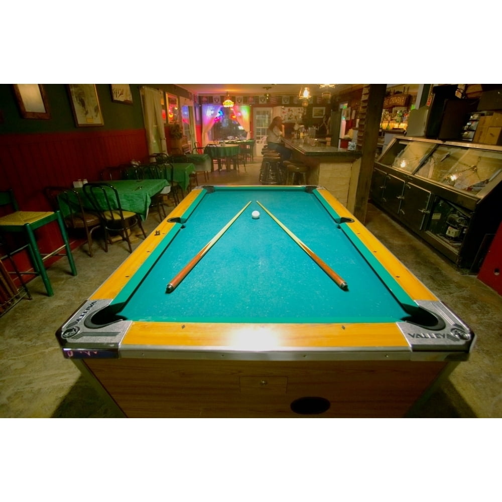 Pool table lit by electric lights in a restaurant and bar in Shoshone ...