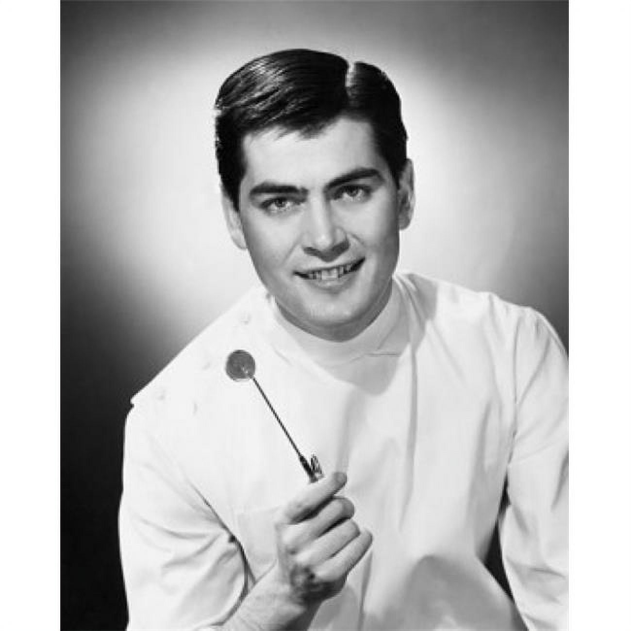 Portrait of a Male Dentist Holding an Angled Mirror & Smiling Poster ...
