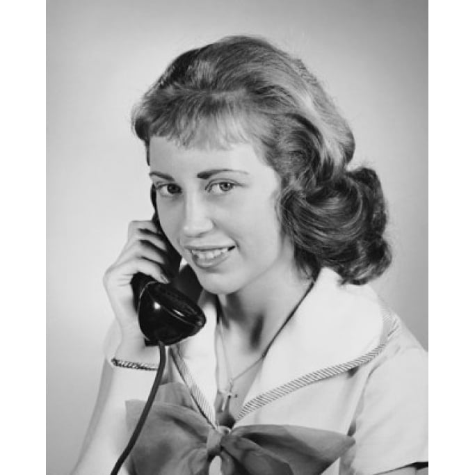 Portrait of a teenage girl talking on the telephone Poster Print (24 x ...