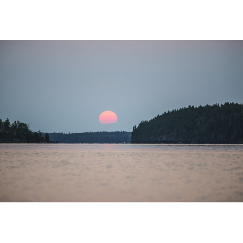 Posterazzi DPI12305745LARGE A Red Sun Setting Over The Forest with A ...