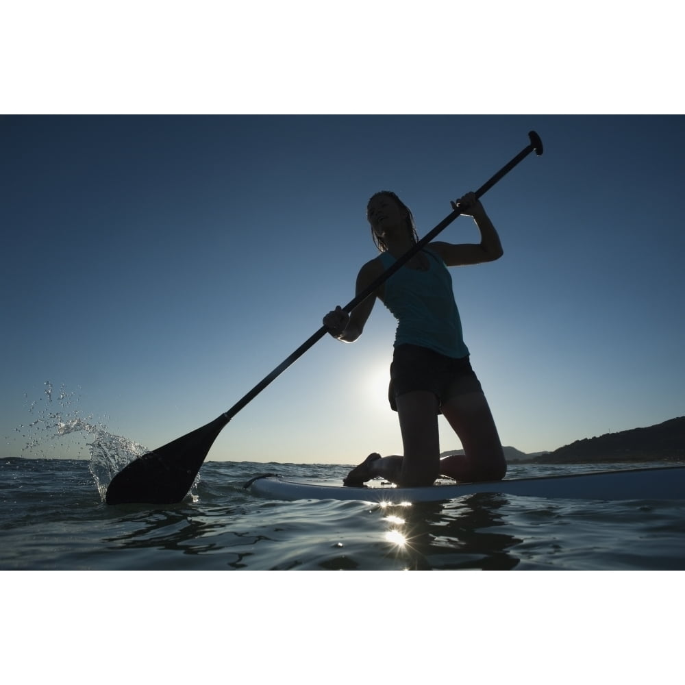 Posterazzi DPI1883352LARGE A Woman Paddling While On Her Knees On A ...