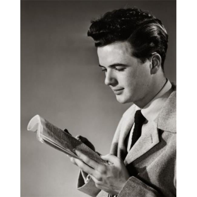 Posterazzi SAL25542673 Side Profile of a Young Man Reading a Newspaper ...