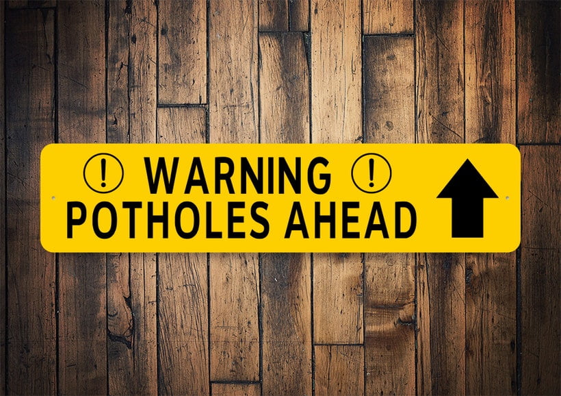 Pothole Ahead Sign