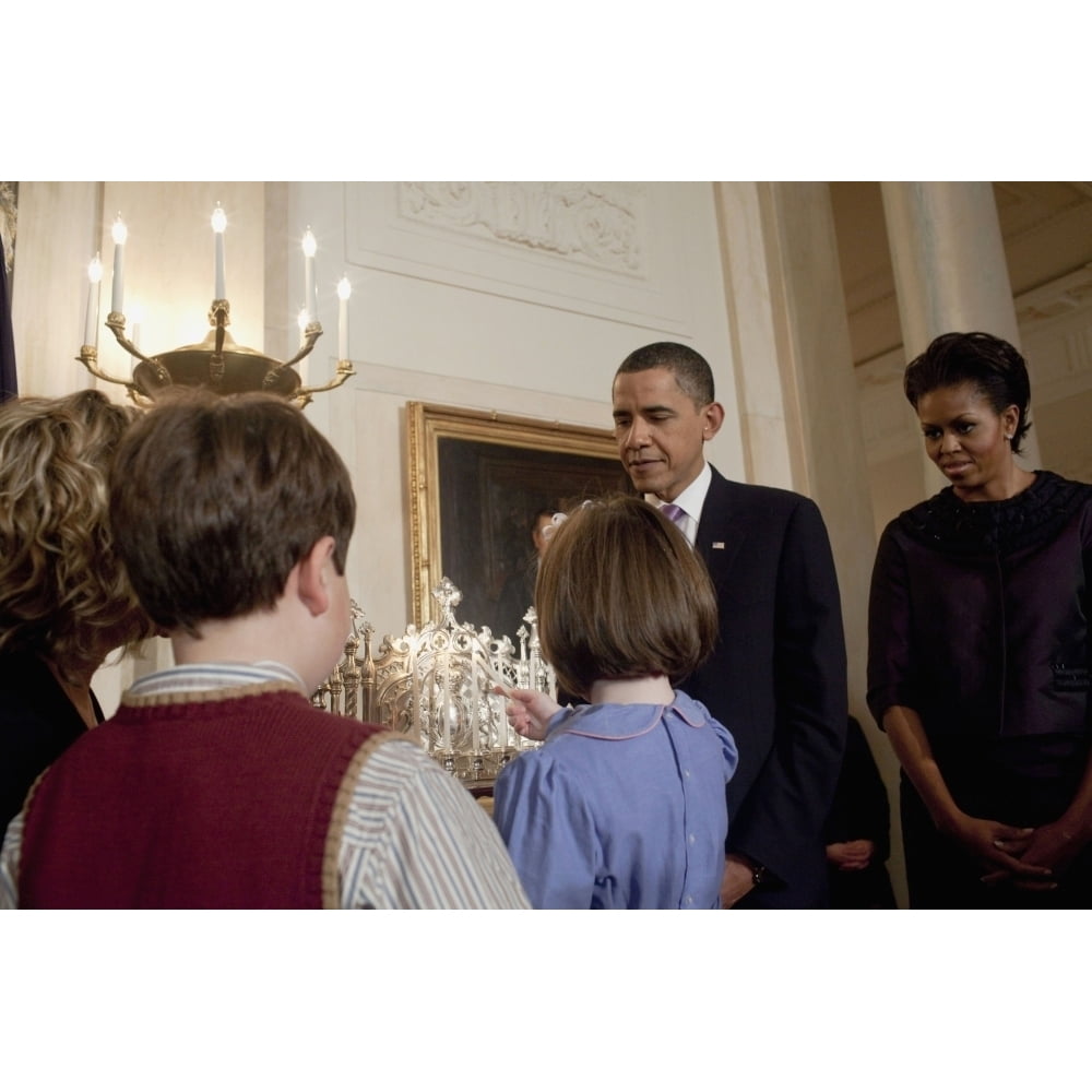President And Michelle Obama Watch As A Child Lights The Hanukkah ...