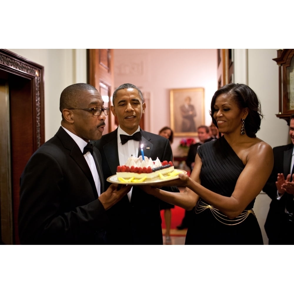 President Barack Obama And Michelle Obama Present A Birthday Cake To ...