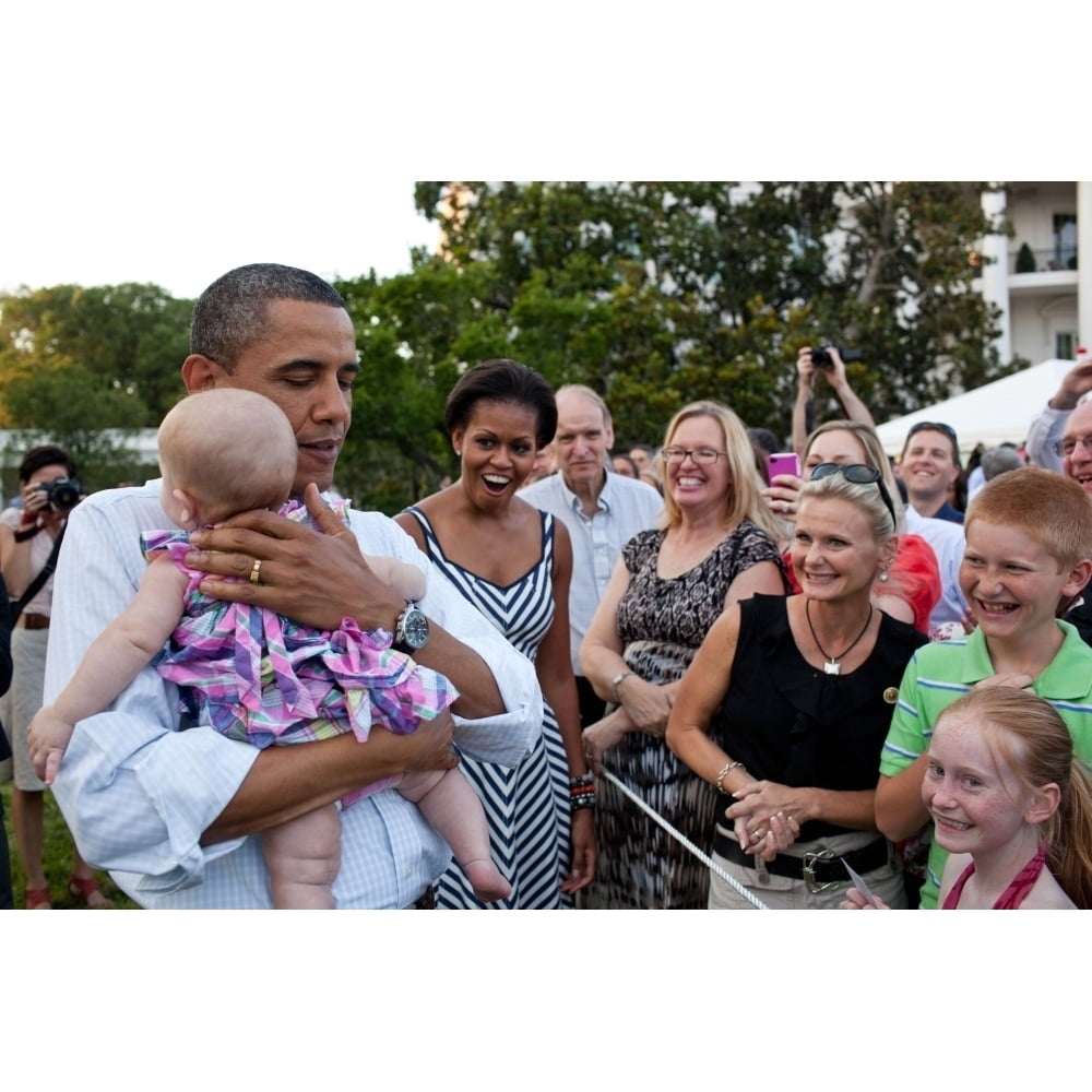President Barack Obama Soothes A Crying Baby At The Congressional ...