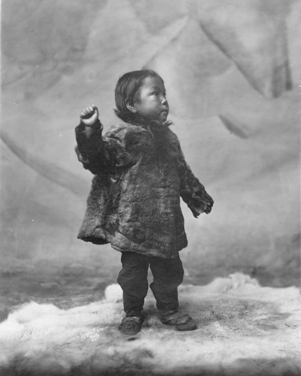 Print: Eskimo Child Posing While Standing On Fur Rug, circa 1900 ...