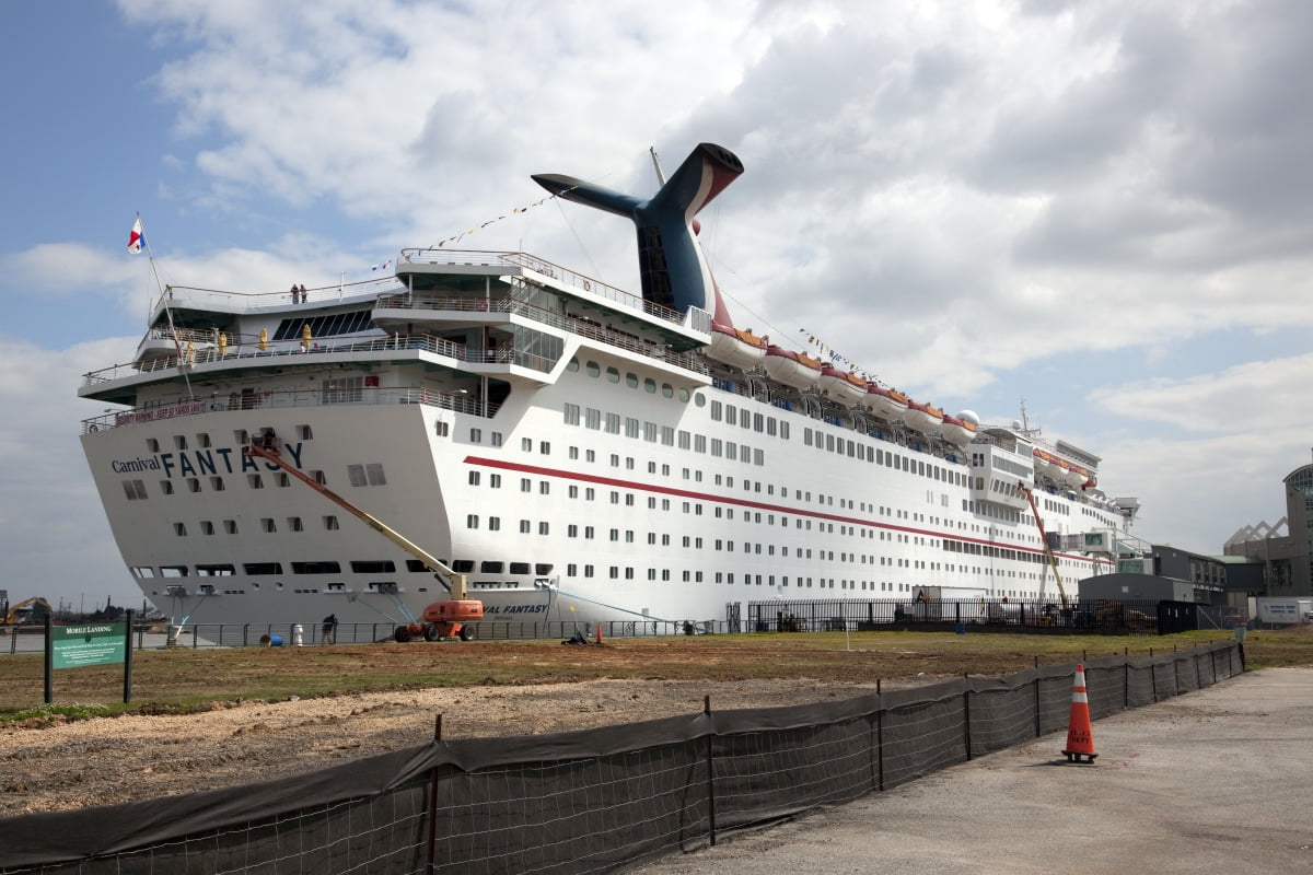 Print: Large Cruise Ship Picks Up Passengers At A Loading Dock A Block ...