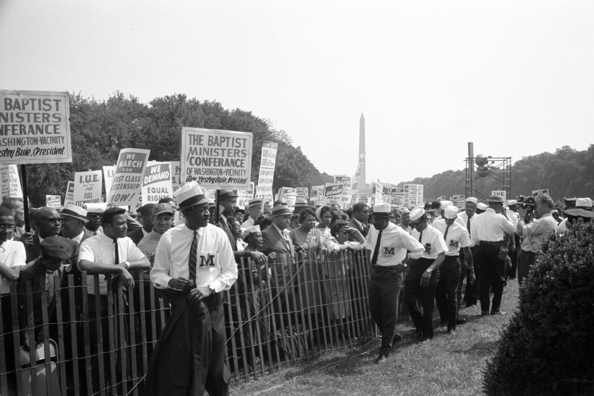 Print: Marshals Standing By Fence Near Crowd Carrying Signs, Including ...