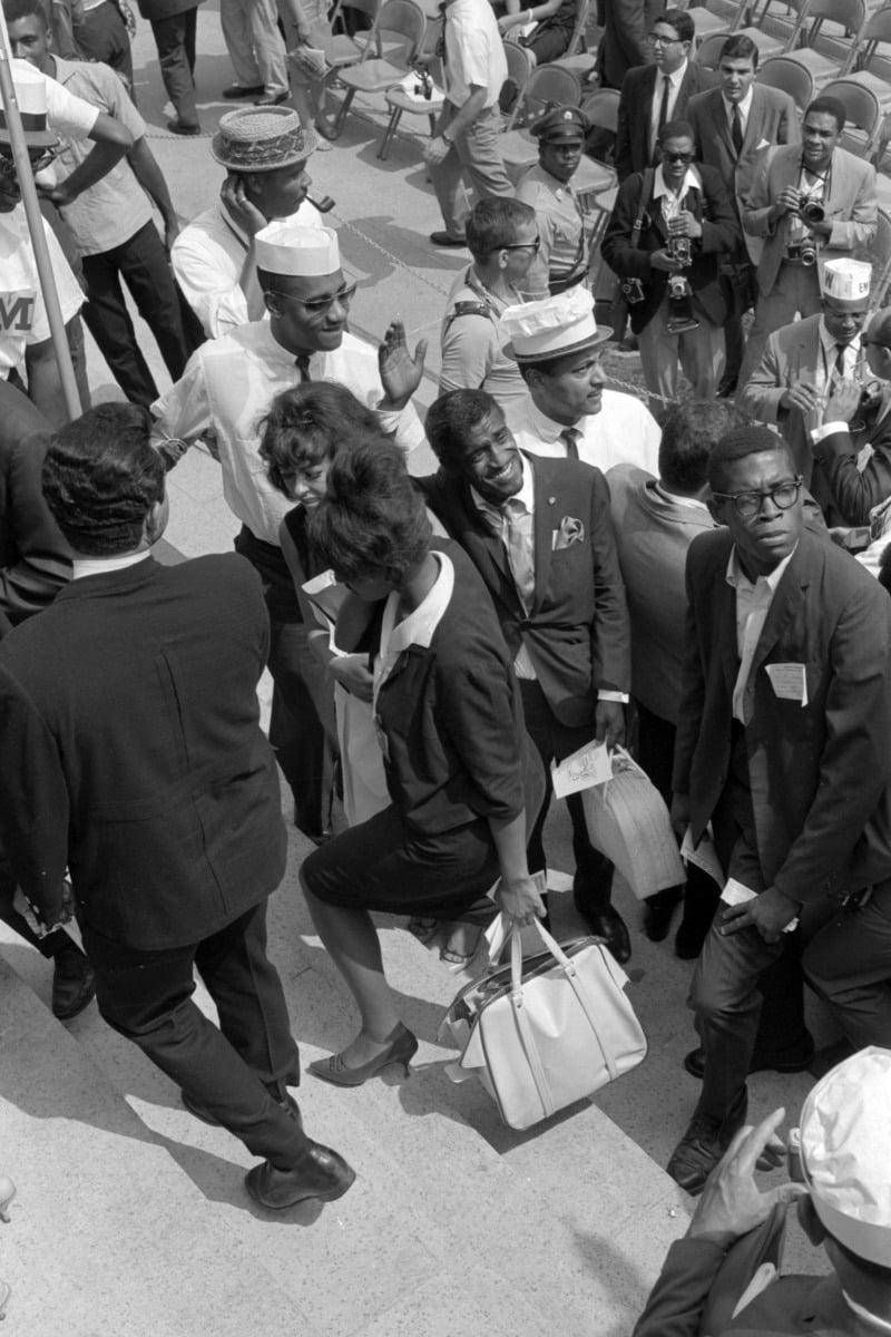 Print: Sammy Davis, Jr., Waving To People As He Walks Past Marshals At ...