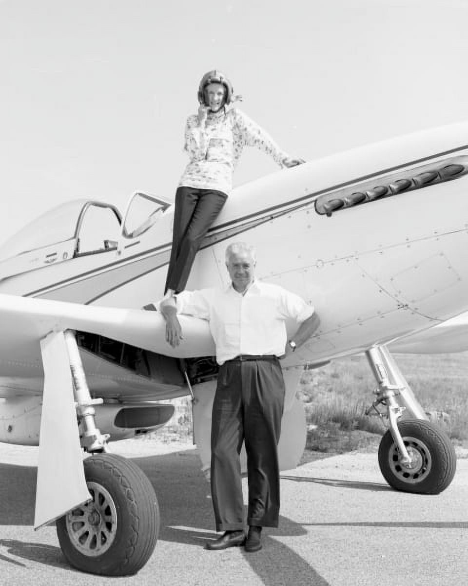 Print: Woman Standing On Wing Of Small Airplane, Man Standing Next To ...