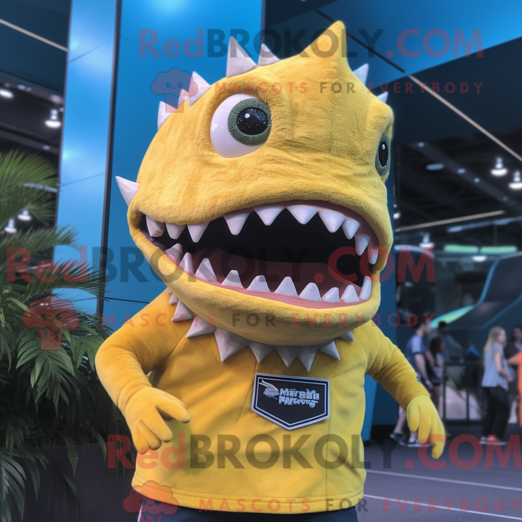 REDBROKOLY mascot character of a Yellow Barracuda dressed with a Tank ...