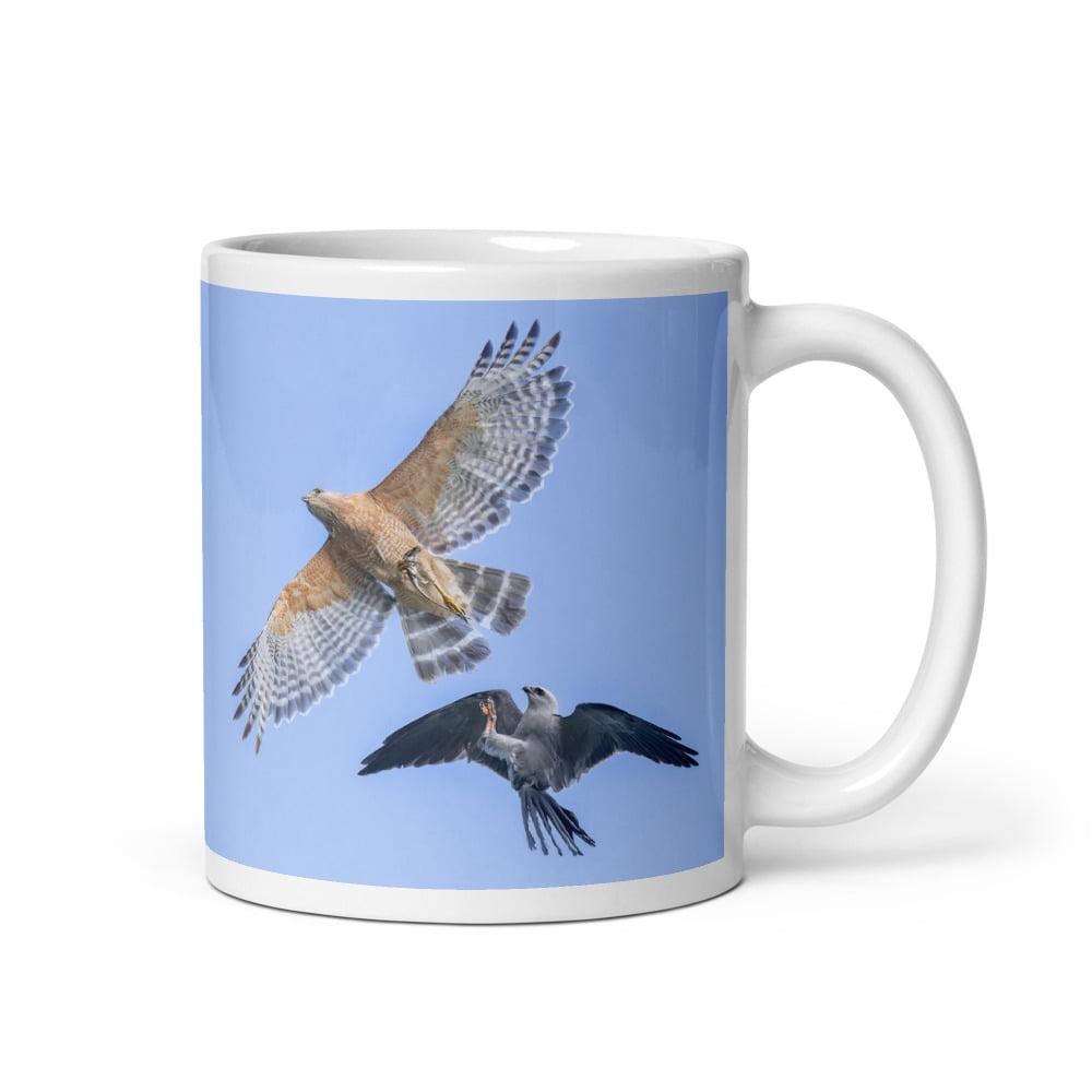 Red-shouldered hawk fighting with Mississippi kite - White glossy mug ...