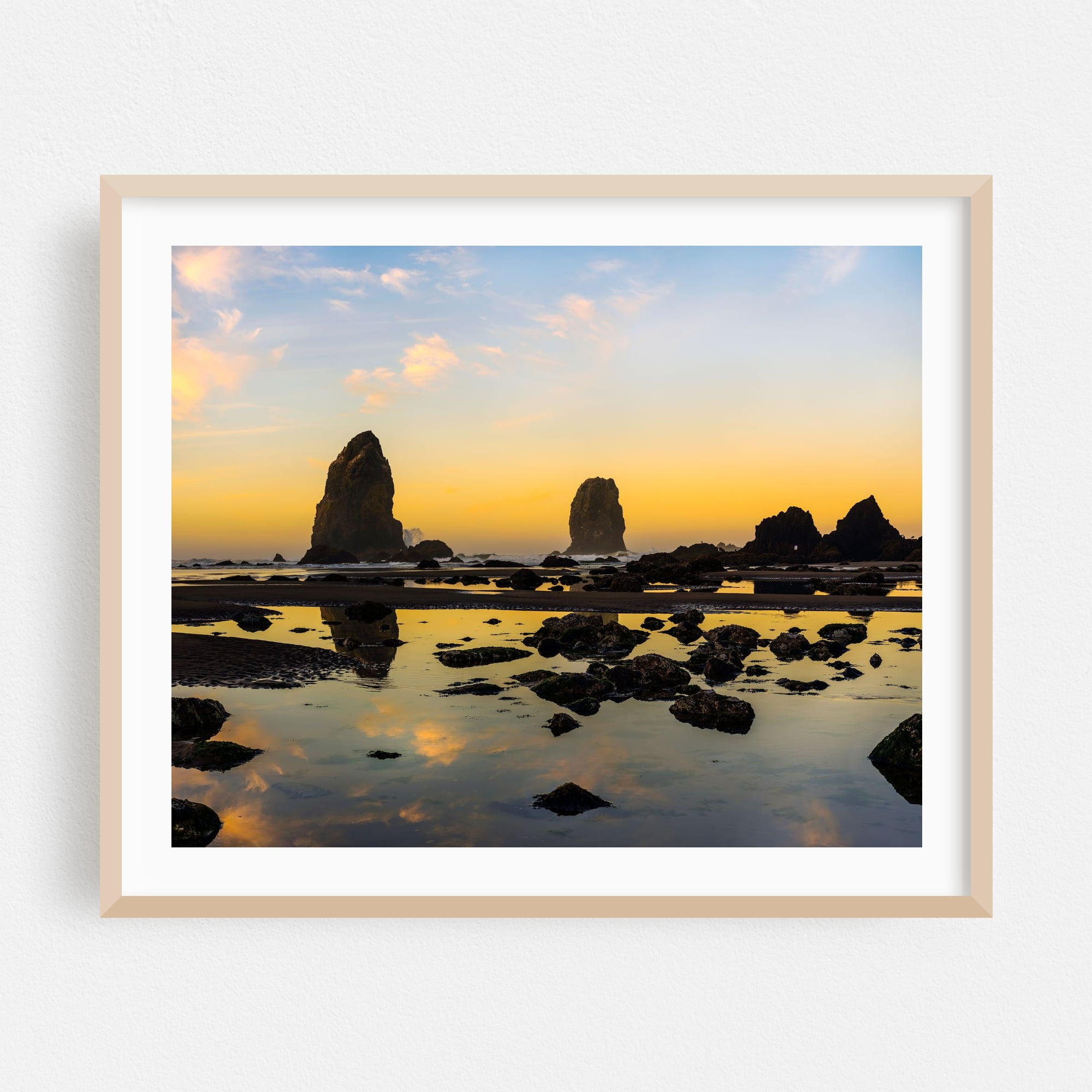 Reflections illuminate the tranquil shore at cannon Beach - Cannon ...