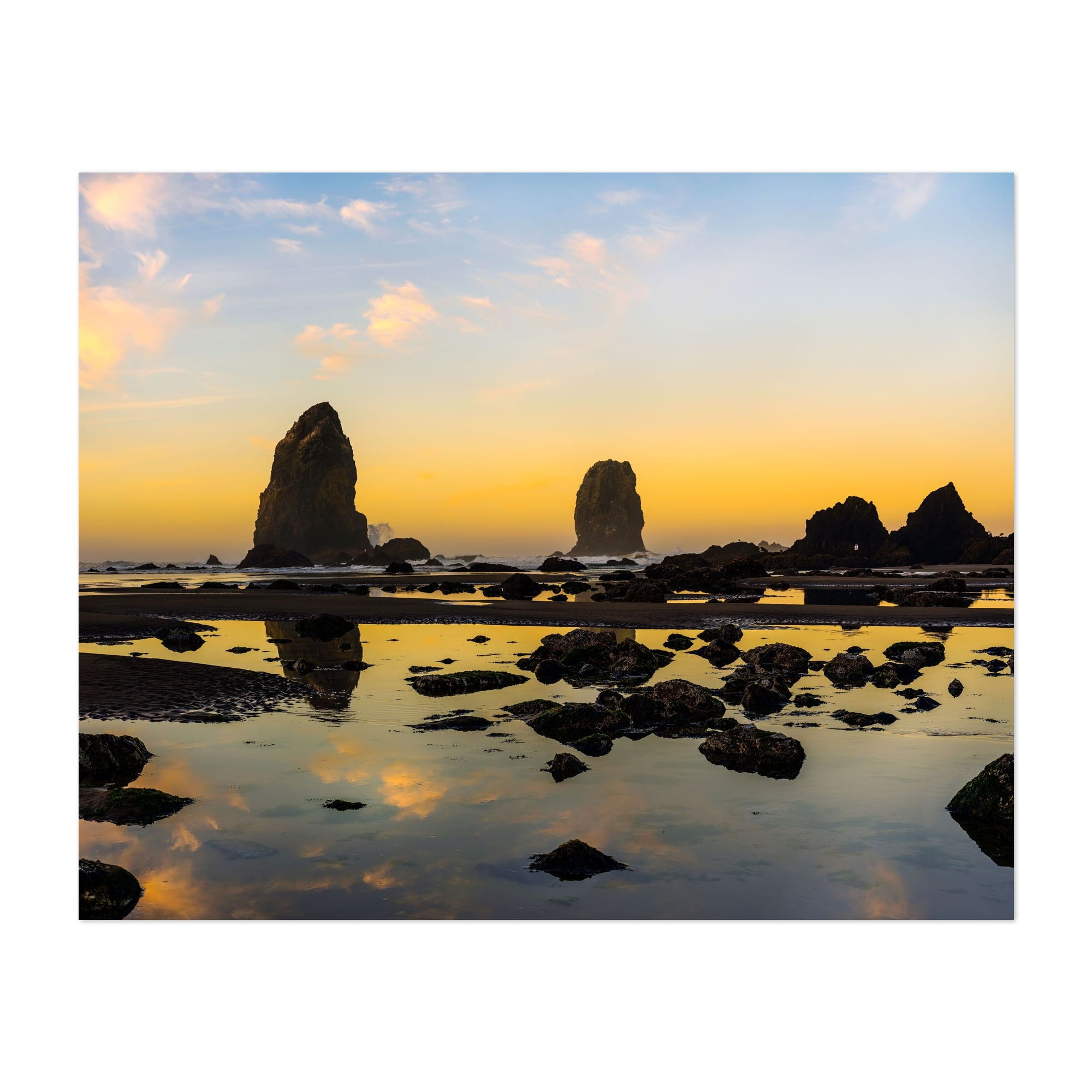 Reflections illuminate the tranquil shore at cannon Beach - Cannon ...
