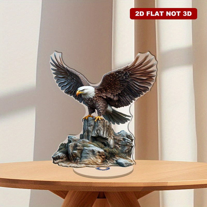 Revolving acrylic display features a majestic eagle on a stone pillar ...