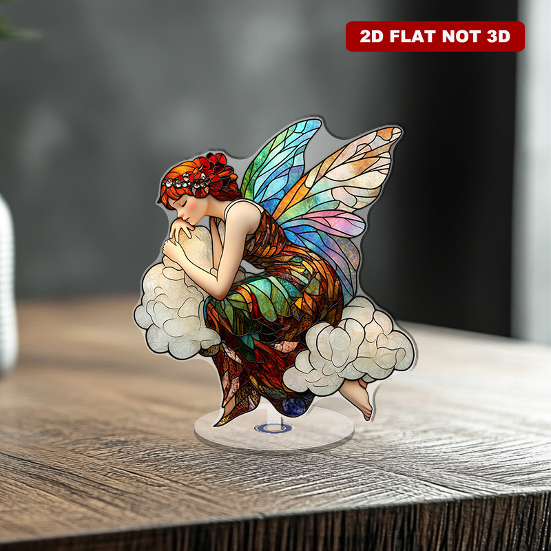 Revolving acrylic display featuring a fairy on soft clouds with bright ...