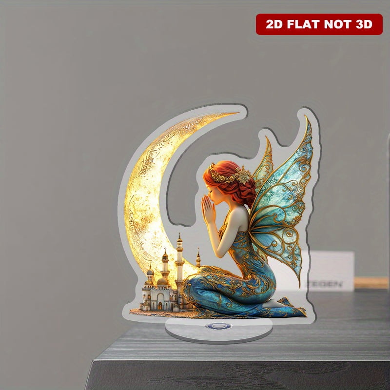 Revolving acrylic display featuring a fairy with red hair and blue gold ...