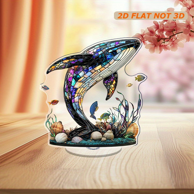Revolving acrylic display featuring a colorful whale surrounded by ...
