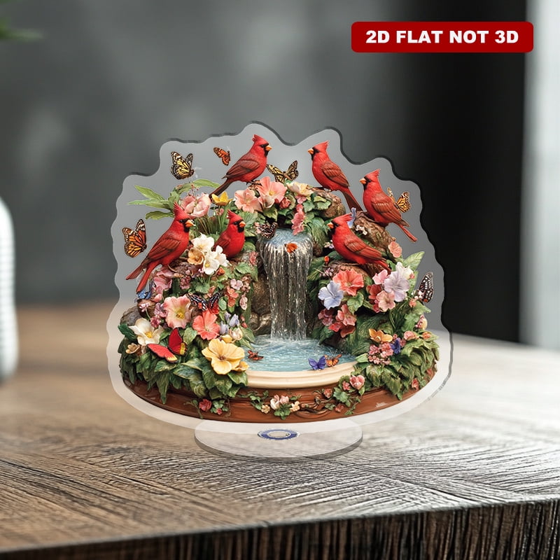 Revolving acrylic display featuring red cardinals amidst flowers ...