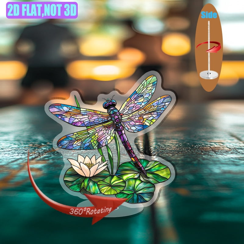 Revolving acrylic display showcasing a delicate dragonfly over a lily ...