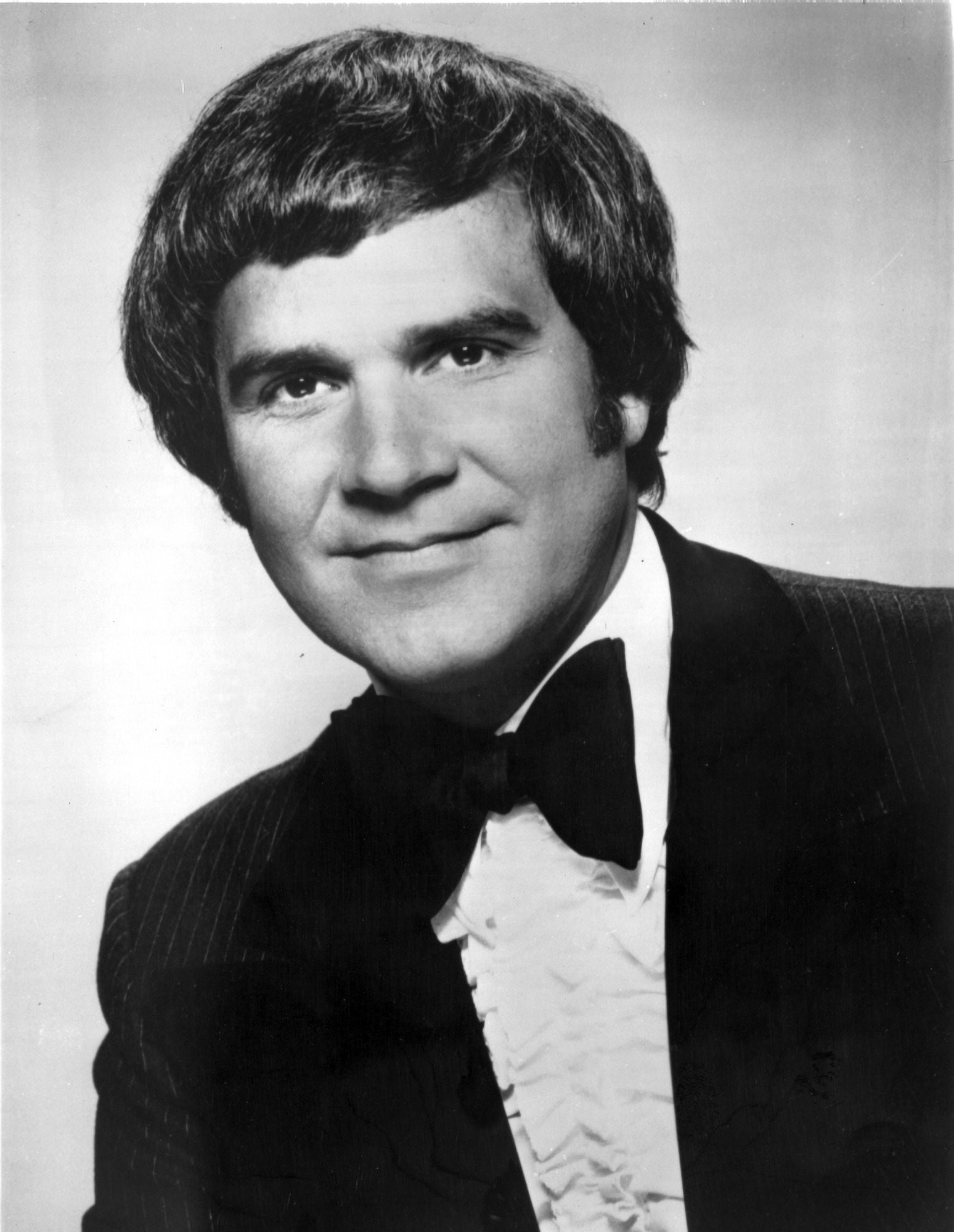 Rich Little wearing a tuxedo and a ruffled shirt Photo Print (8 x 10 ...