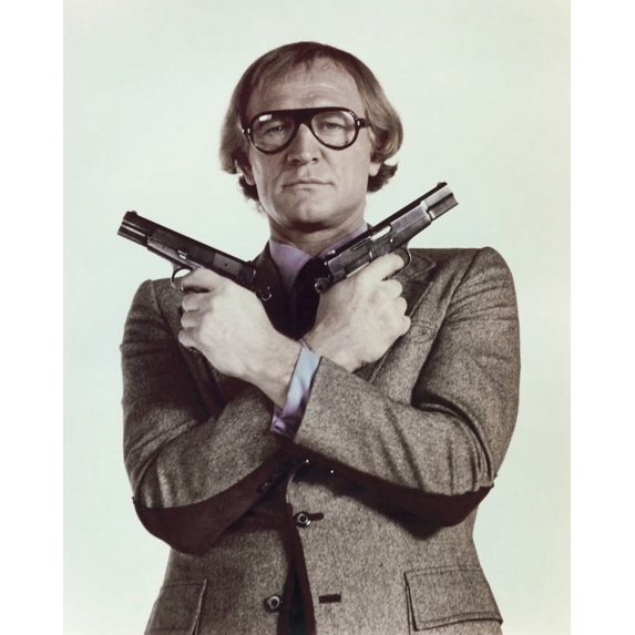 Richard Harris In 99 And 44/100% Dead Holding Two Guns Across His Chest ...
