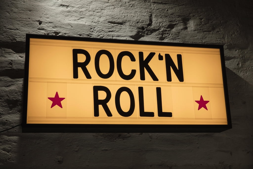 Rock N Roll Music Store Signboard Against Gray Wall Photo Photograph ...