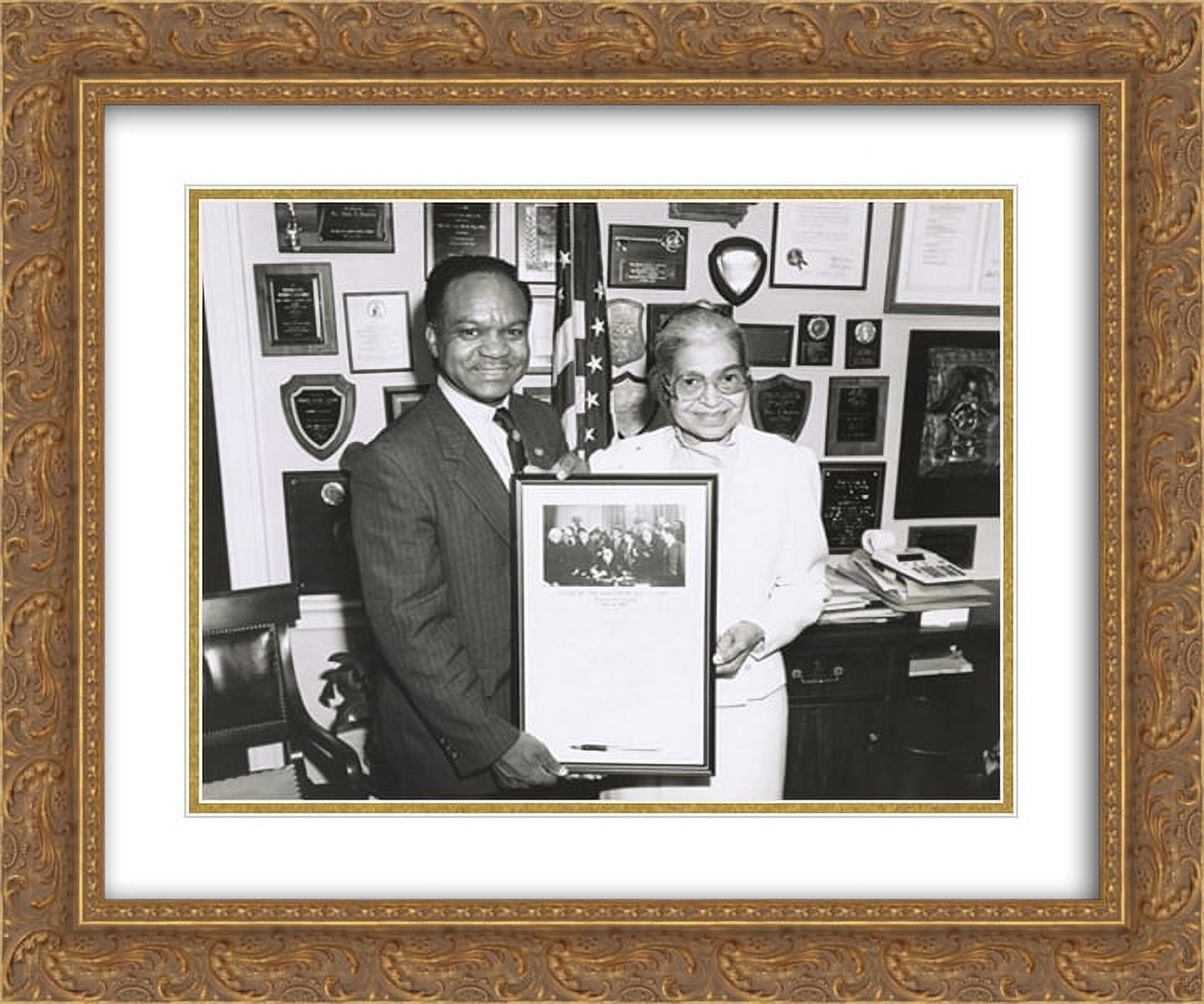 Rosa Parks and Congressman Walter Fauntroy holding a framed picture of ...