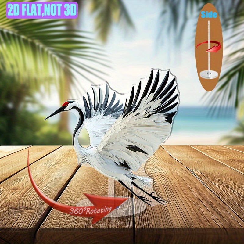 Rotatable acrylic ornament featuring a graceful crane in flight with ...