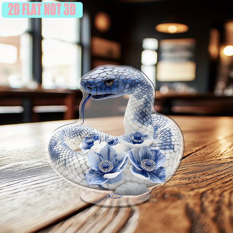 Rotatable acrylic ornament featuring a blue-and-white resin snake with ...