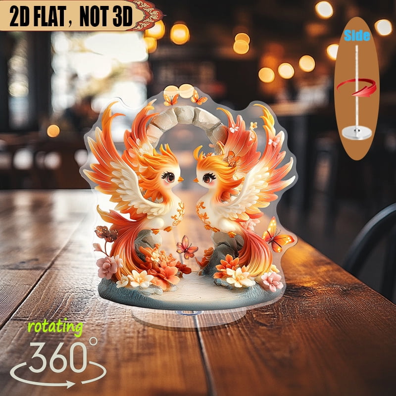 Rotating acrylic centerpiece featuring two phoenix figurines amidst ...