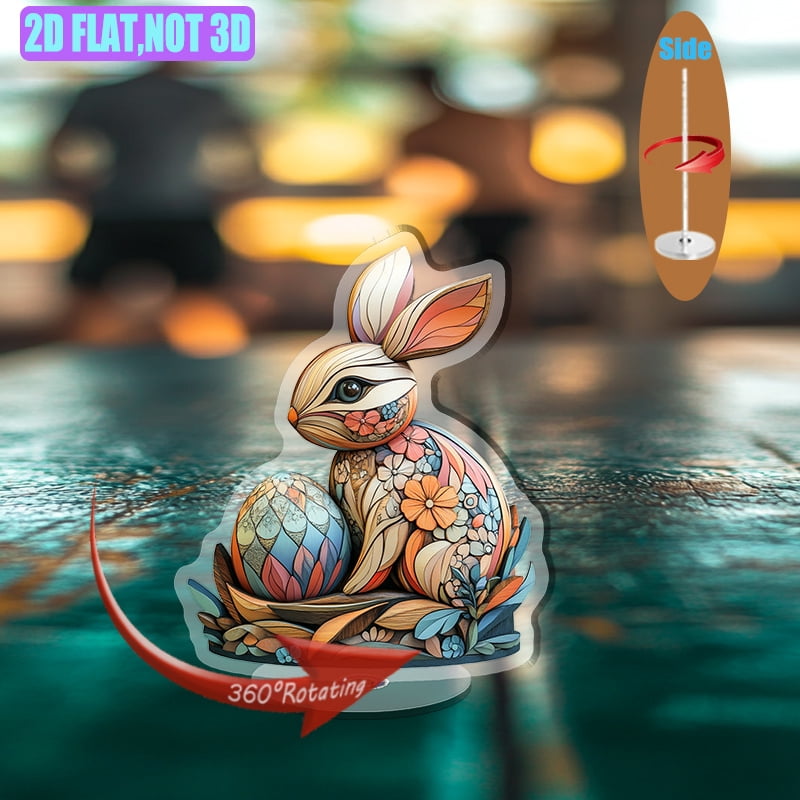 Rotating acrylic decoration featuring colorful rabbit and egg on a flat ...
