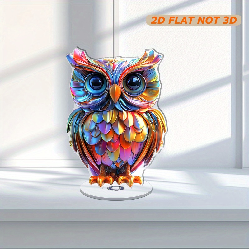 Rotating acrylic display features a vibrant owl with high detail and a ...