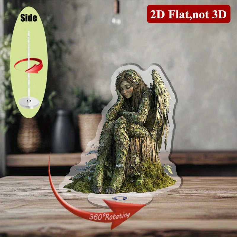 Rotating acrylic display features a winged dryad by a moss-covered ...